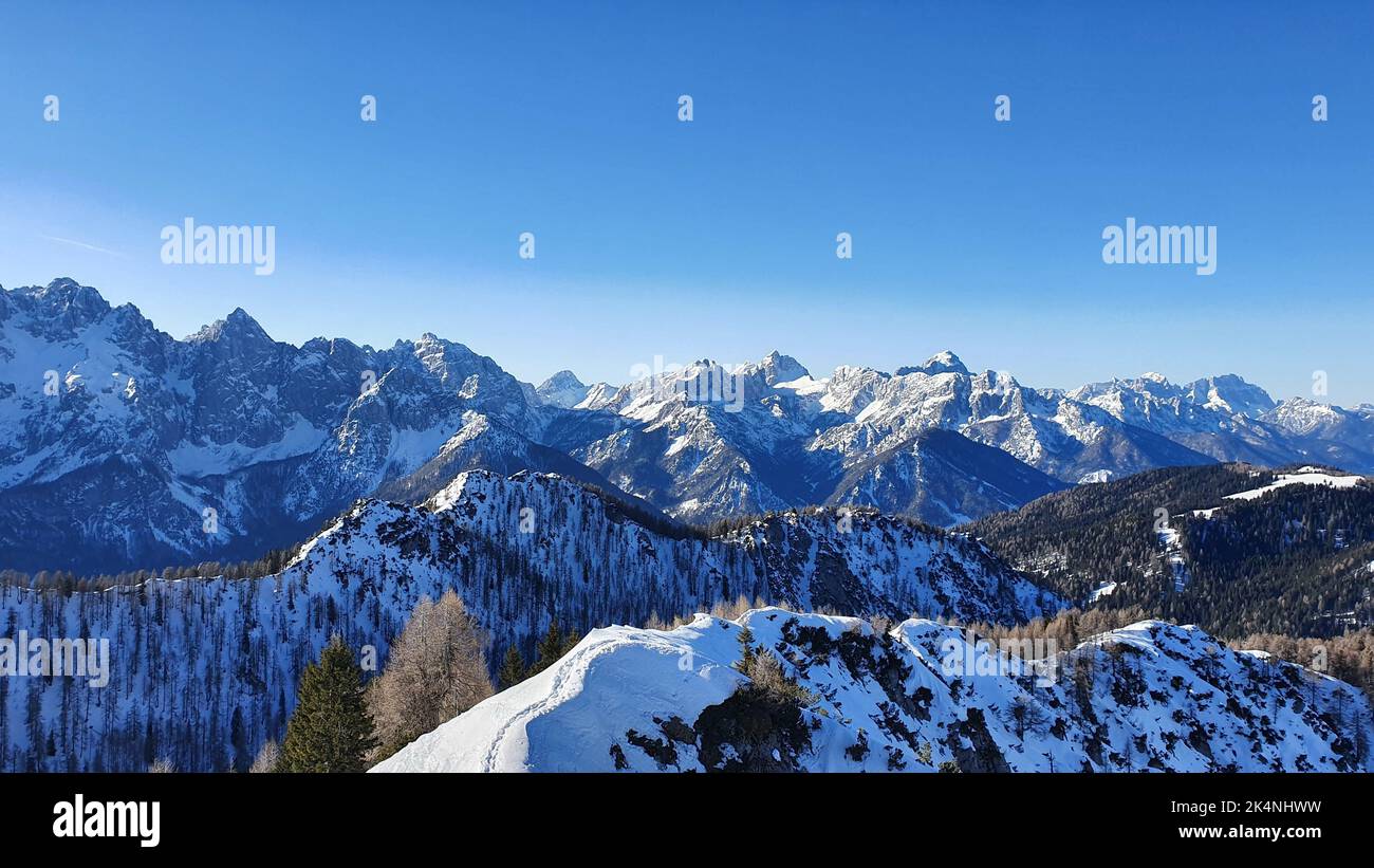 A Scenic view of snowy peaks of mountains range on a sunny day Stock ...