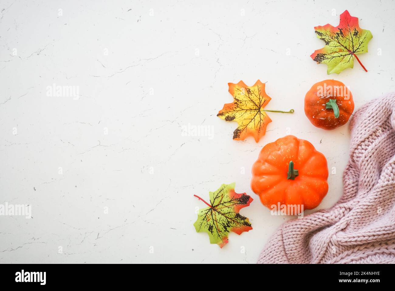 Autumn background with copy space at white marble table. Pumpkins ...