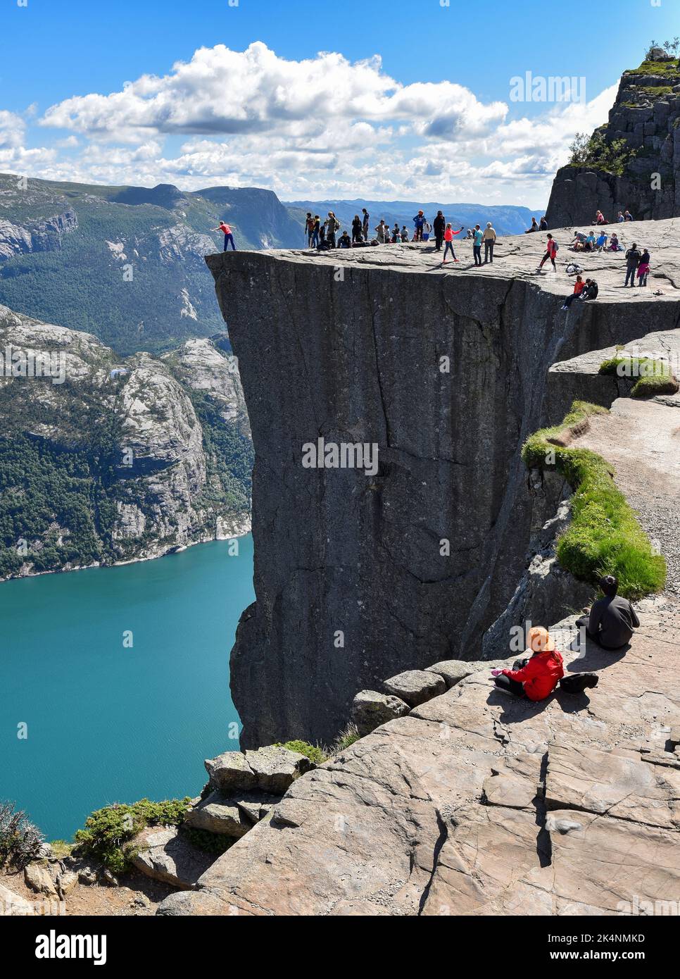 Tourists visiting the top of Preikestolen or "The Pulpit Rock" , a ...