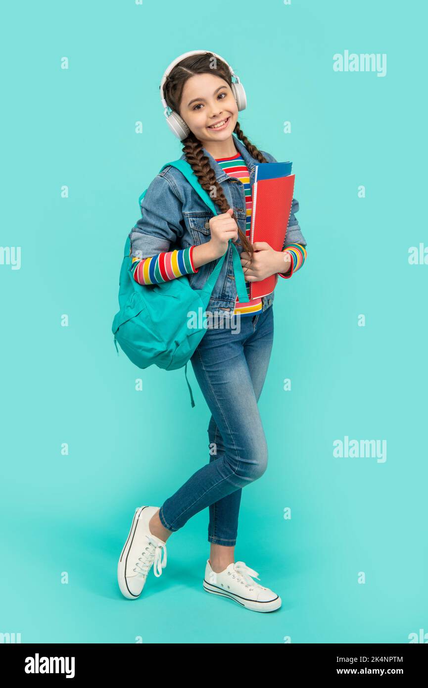 Happy teenage girl going to music school. Teenager listening to music ...