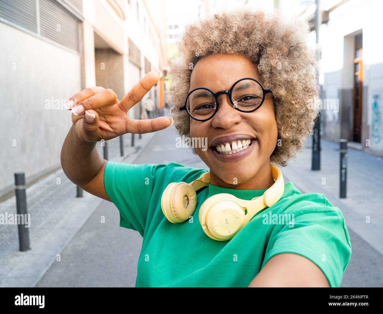 Perspective selfie of a happy african american woman with afro hair ...