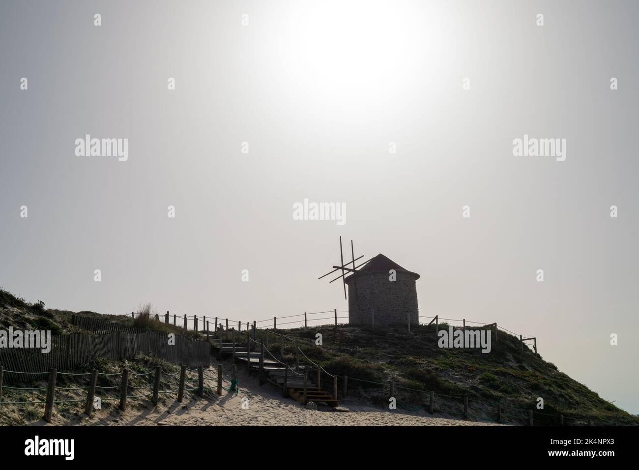 Beautiful windmills on the coastline, sea life themes. Windmill on sand ...