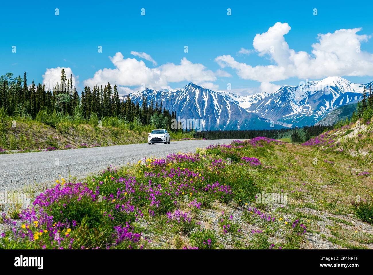 Travelers in automobile; view west of Saint Elias Mountains; Kluane ...