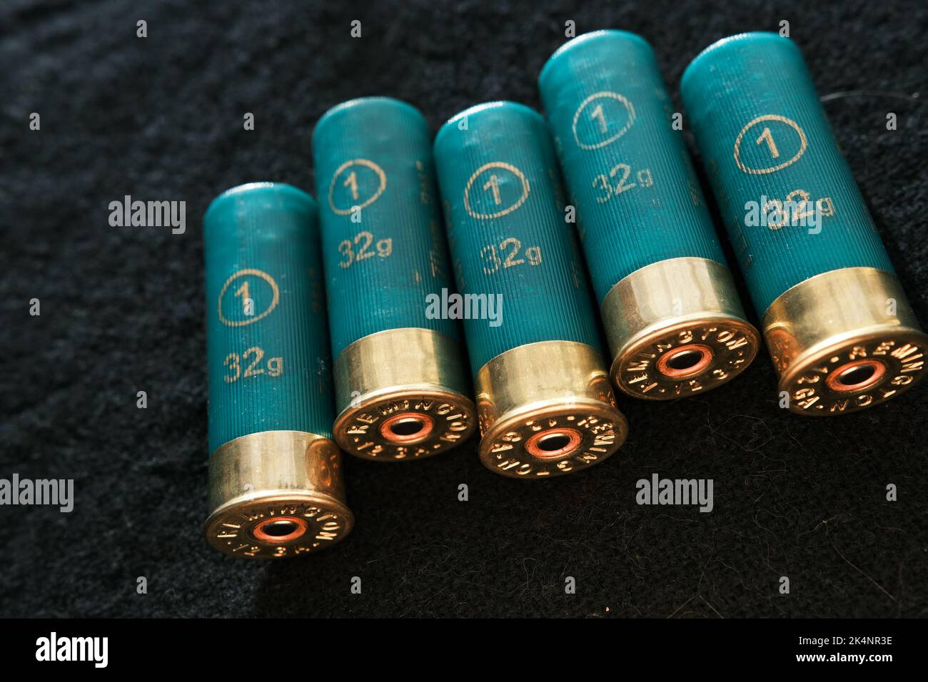 Shotgun shells on a black surface. Ammunition for 12 gauge smoothbore ...