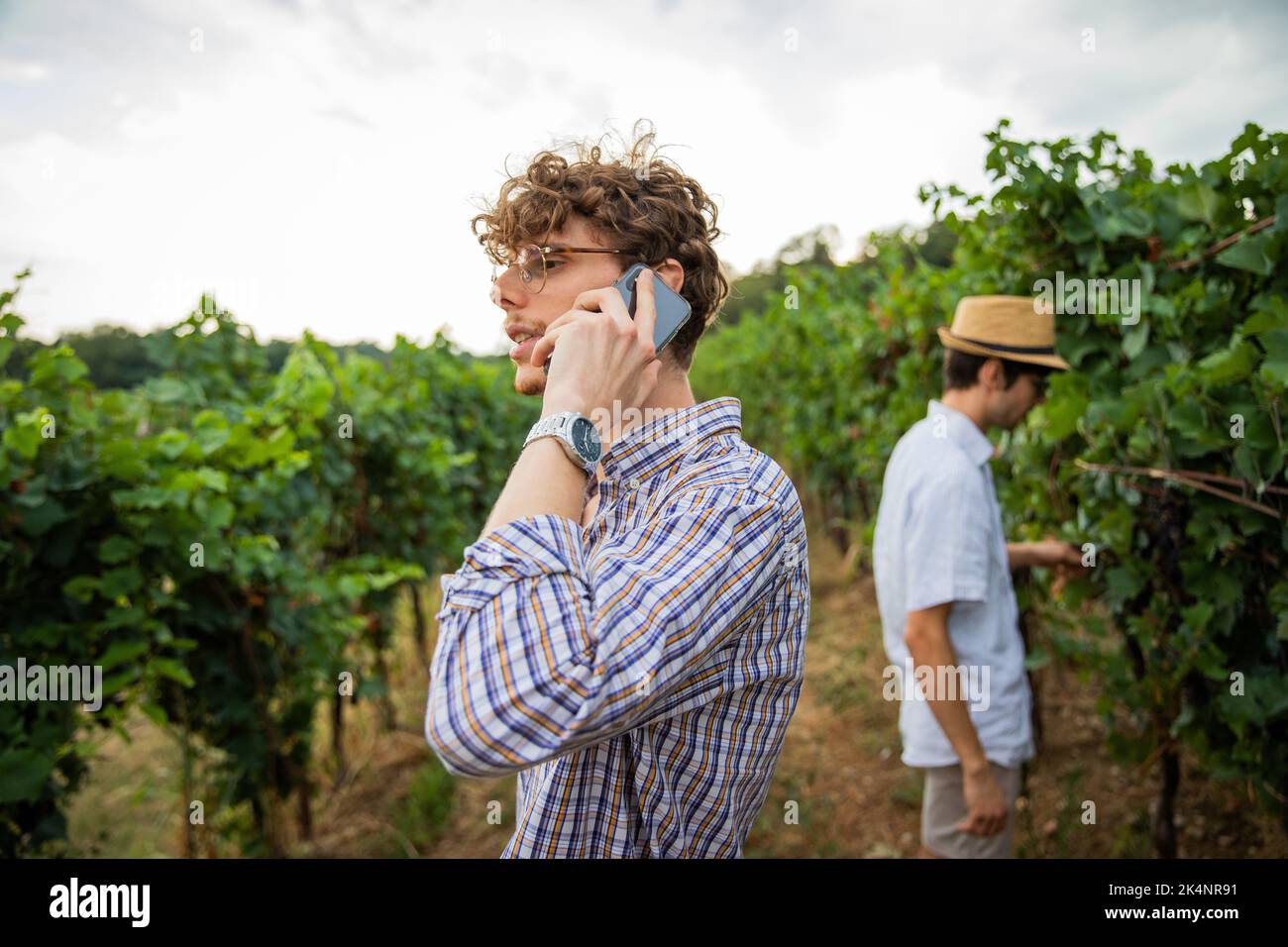 The insurer makes a phone call during his inspection visit to an ...