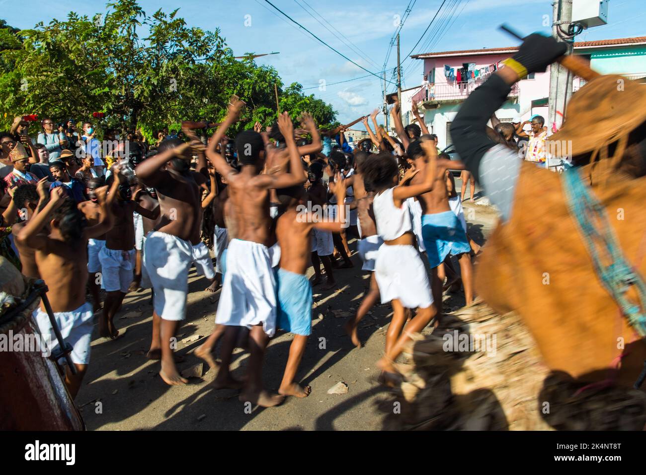 Members of the cultural event Nego Fugido sing and sit on the ground ...