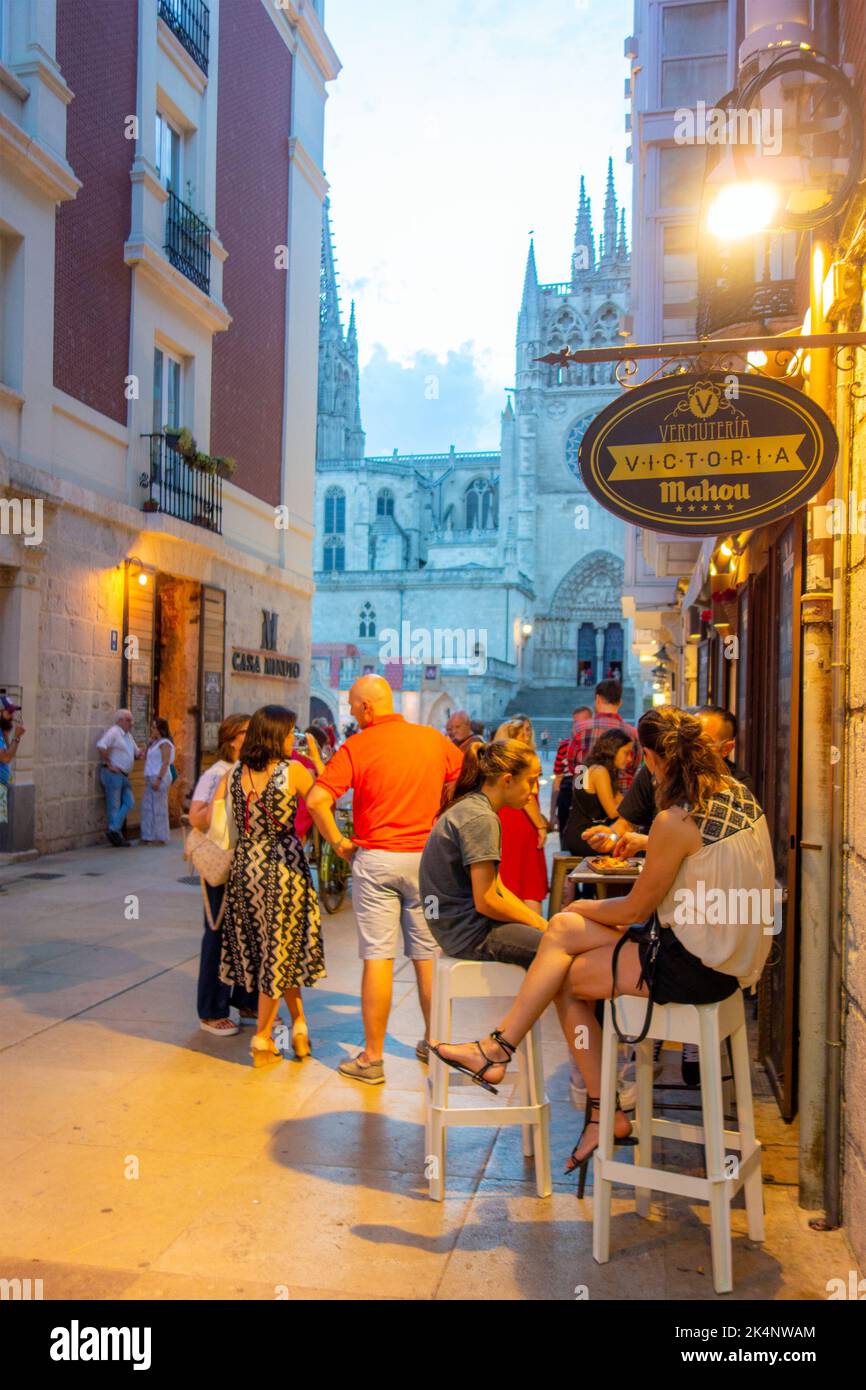Nighttime evening dusk in the side streets of Burgos Spain with people ...