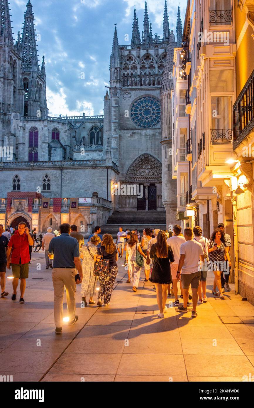 Nighttime evening dusk in the side streets of Burgos Spain with people ...