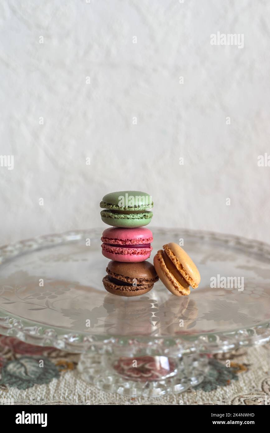 Stacked macarons on a glass plate Stock Photo - Alamy