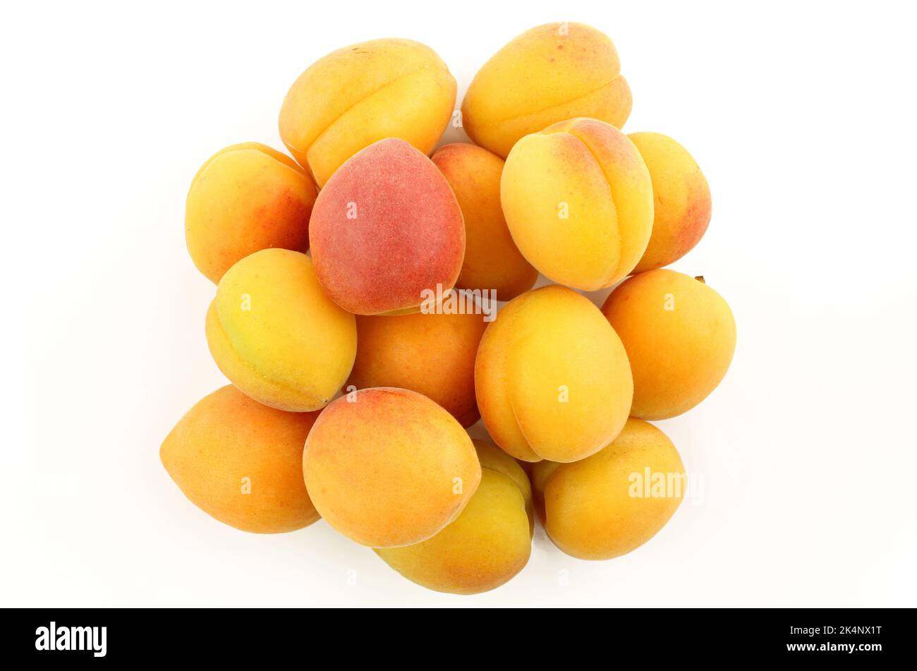 Pile of whole apricots isolated on white background.Ripe sweet fruit ...