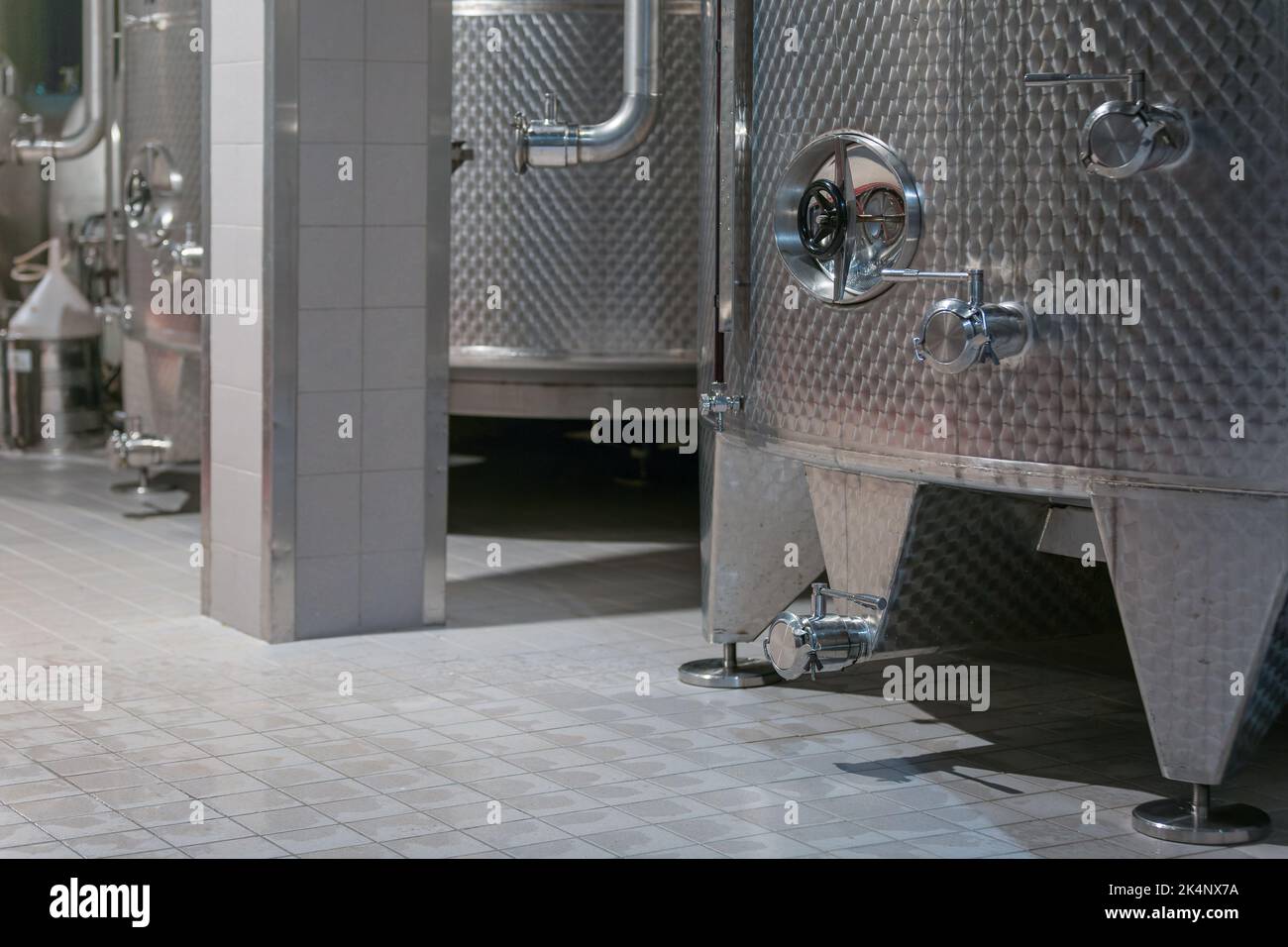 Modern wine cellar with new large inox stainless steel tanks for the ...