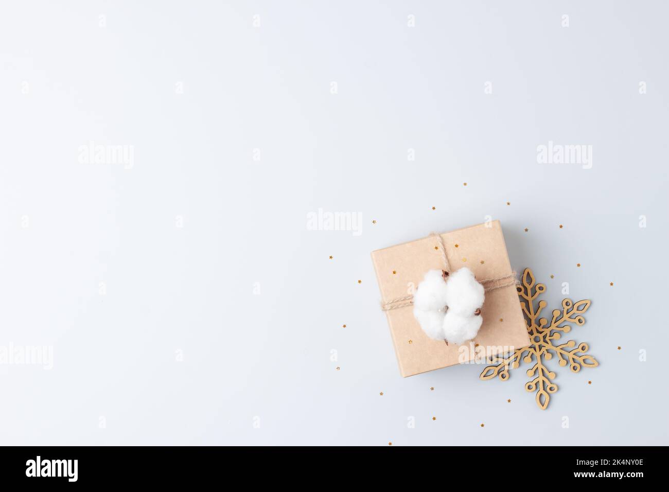 Christmas decorations with packaging gift in craft paper and flower on ...