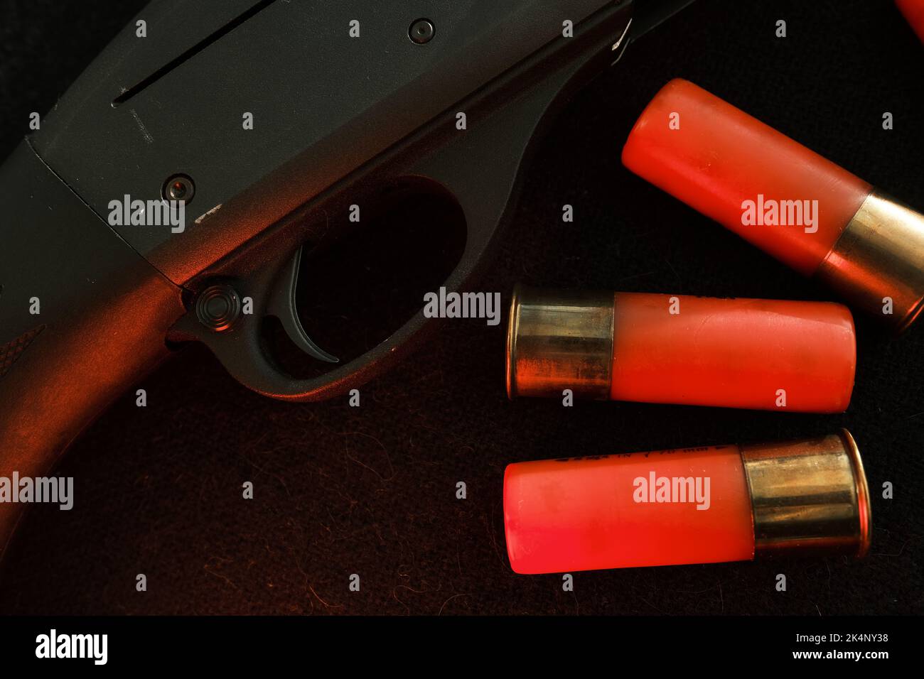 Trigger of a rifle on black background with red lightning with Shotgun ...