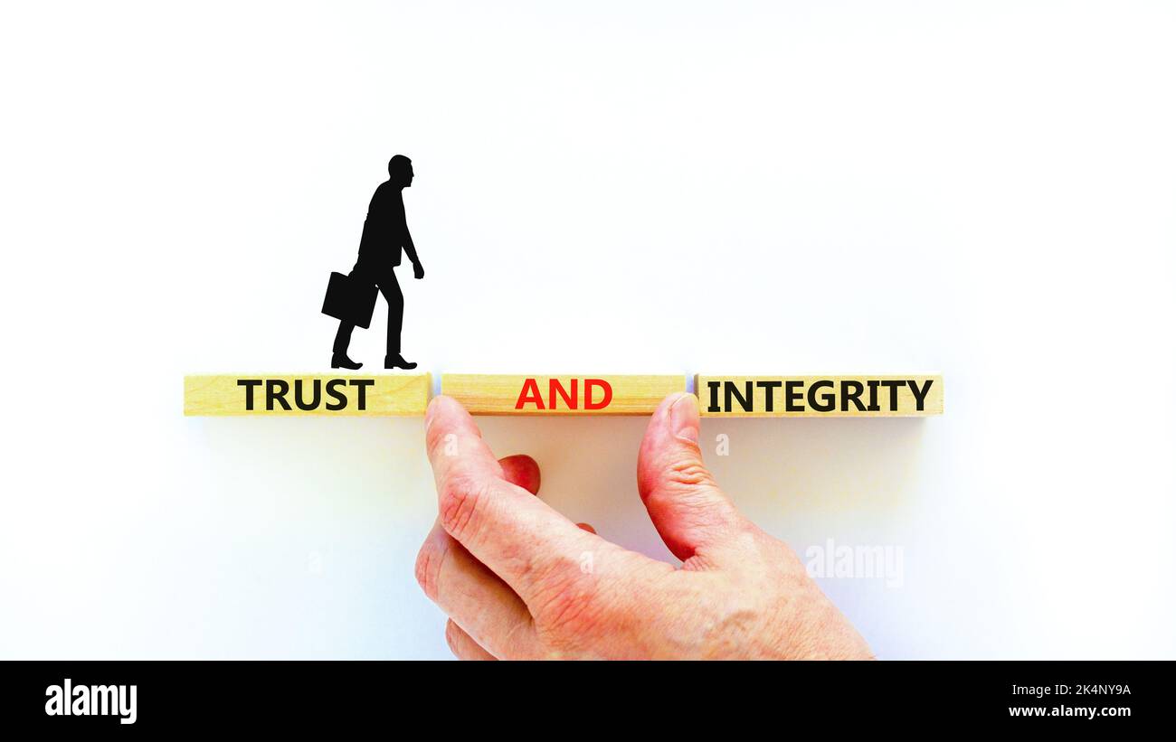 Trust and integrity symbol. Concept words Trust and integrity on wooden ...