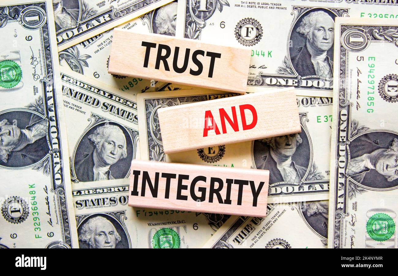 Trust and integrity symbol. Concept words Trust and integrity on wooden ...