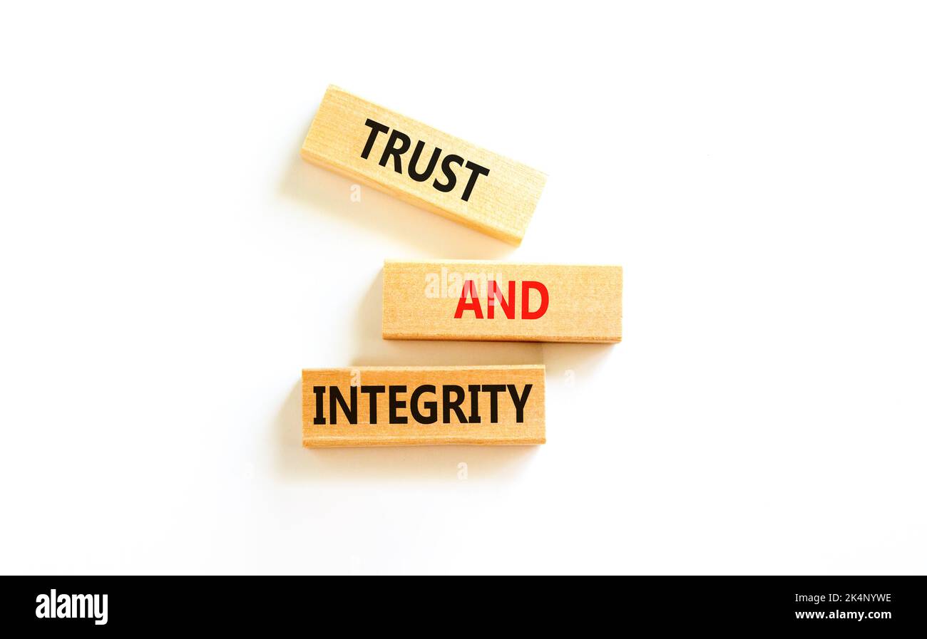 Trust and integrity symbol. Concept words Trust and integrity on wooden ...