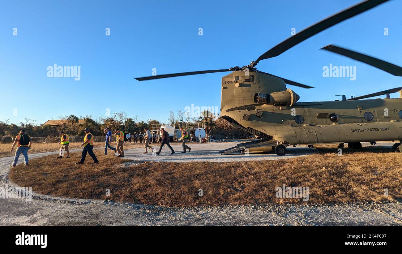 A civilian search and rescue exit a CH-47F Chinook helicopter operated ...