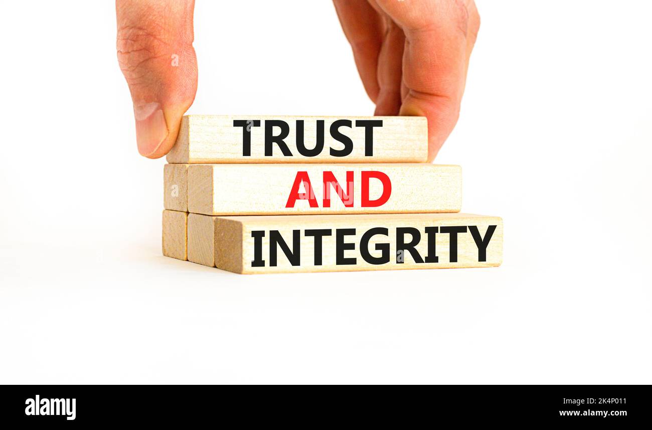 Trust and integrity symbol. Concept words Trust and integrity on wooden ...