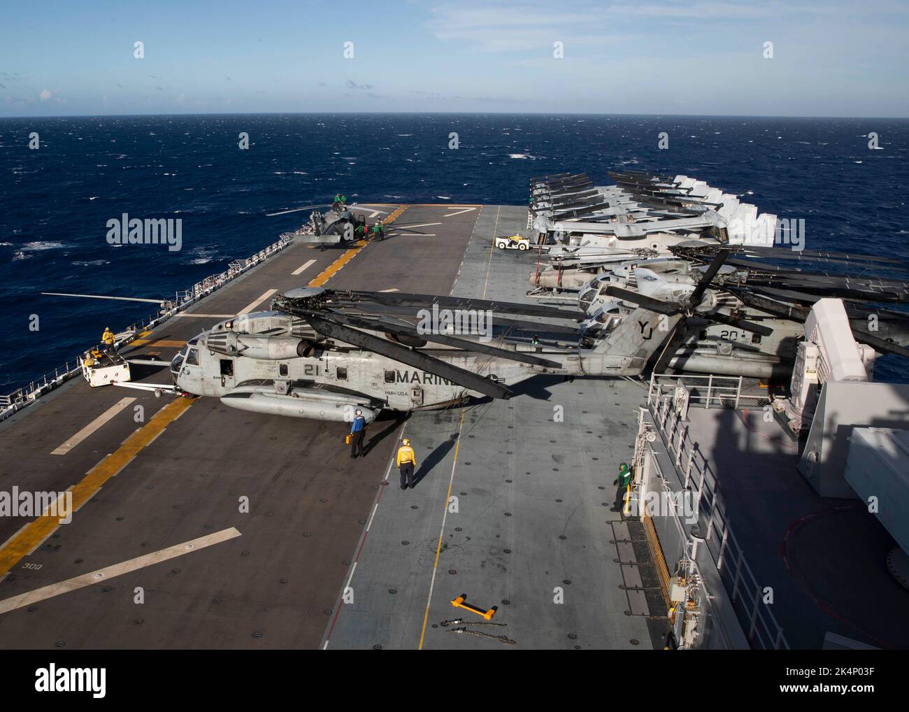221003-N-TT639-1001 PHILIPPINE SEA (Oct. 3, 2022) – Sailors tow a CH-53 ...