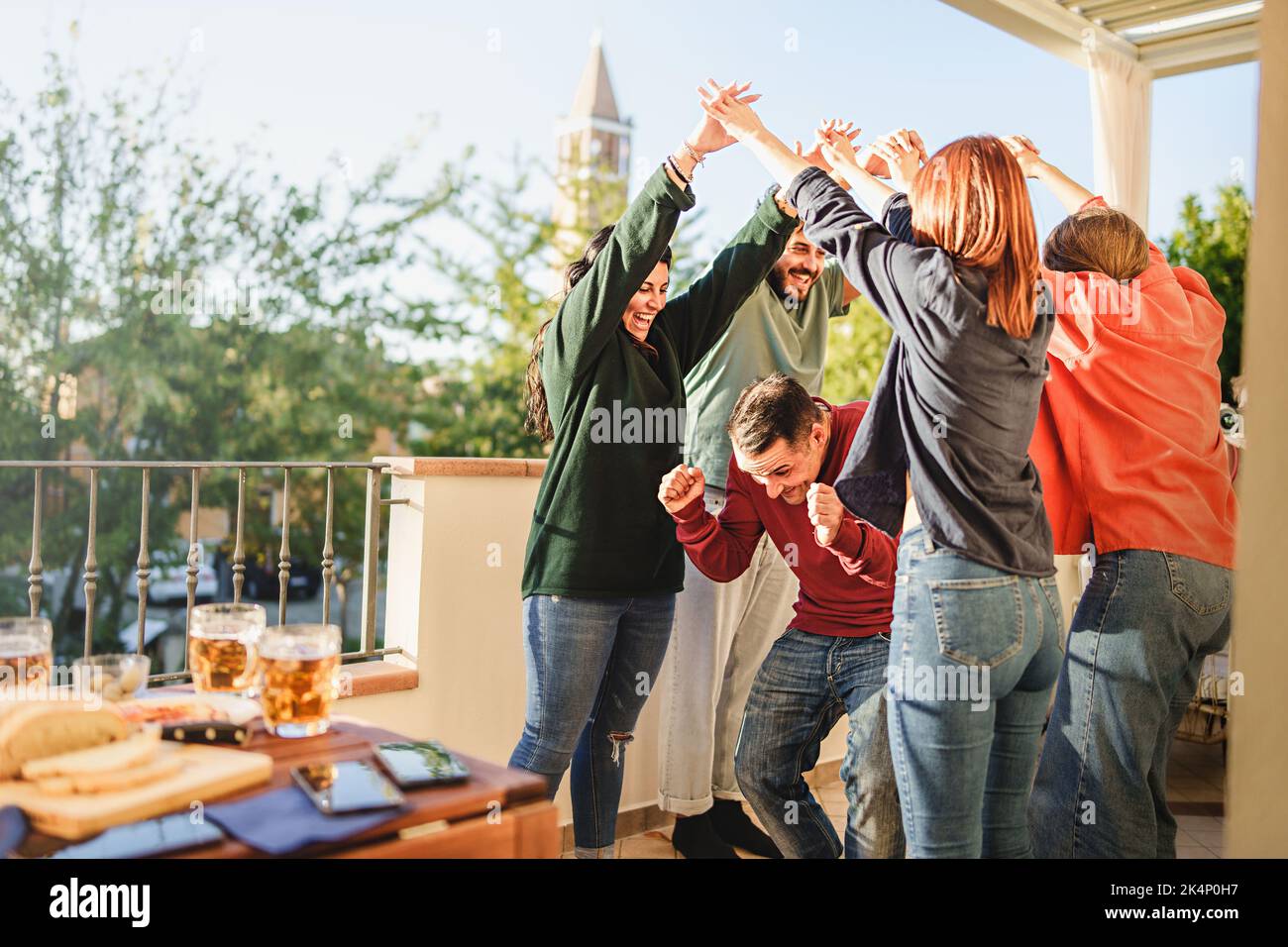 Happy group of young friends partying together dancing and having fun ...
