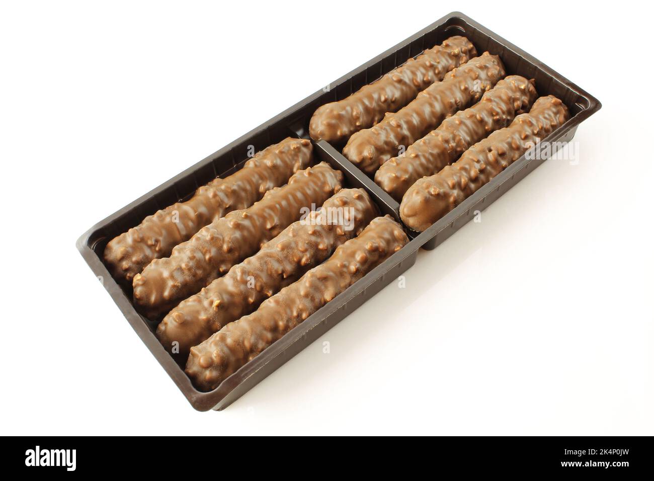 Chocolate coated wafer sticks in plastic package isolated on white ...