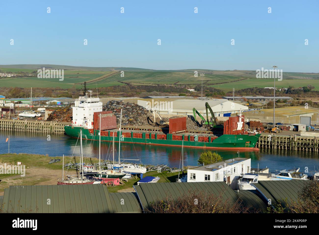 A ship loads metal recyclable waste at Newhaven port, East Sussex, UK ...