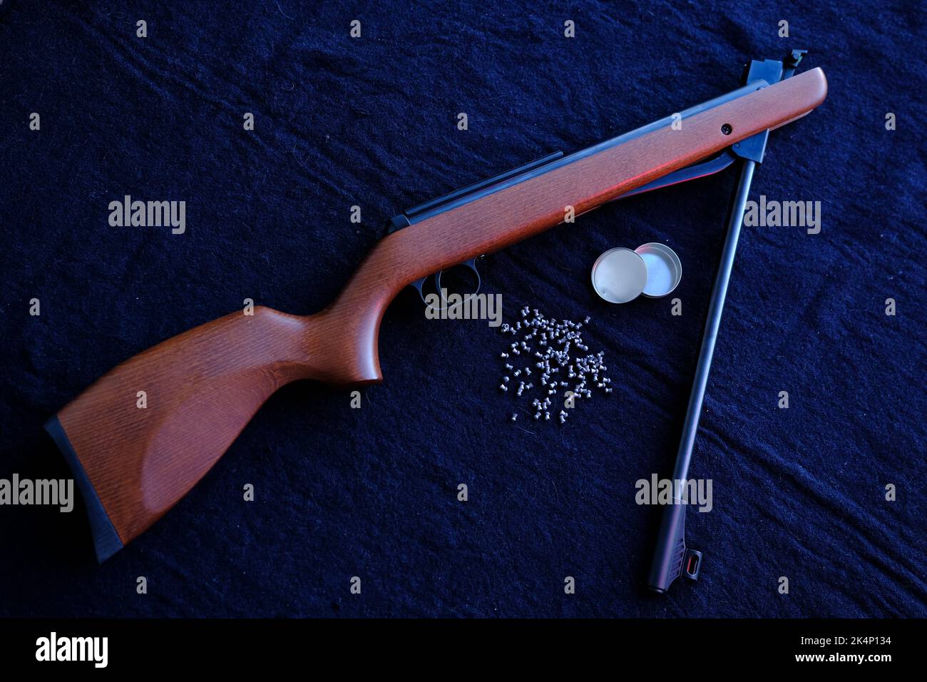 Rifle gun break in two with air pellets for hunting on cloth dark ...