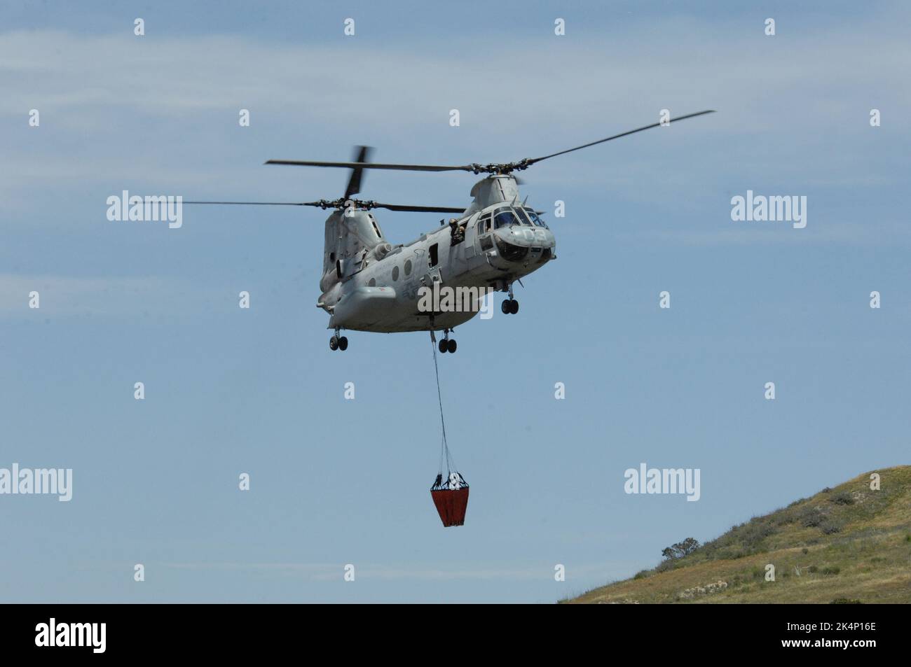 USMC CH-46 Sea Knight inbound with a bambi bucket aboard Camp Pendleton ...
