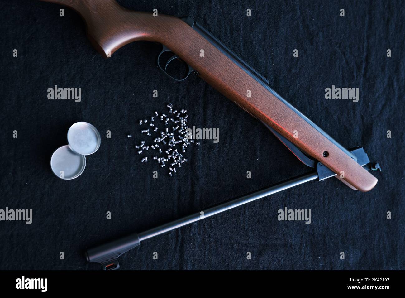 Rifle gun break in two with air pellets for hunting on cloth dark ...
