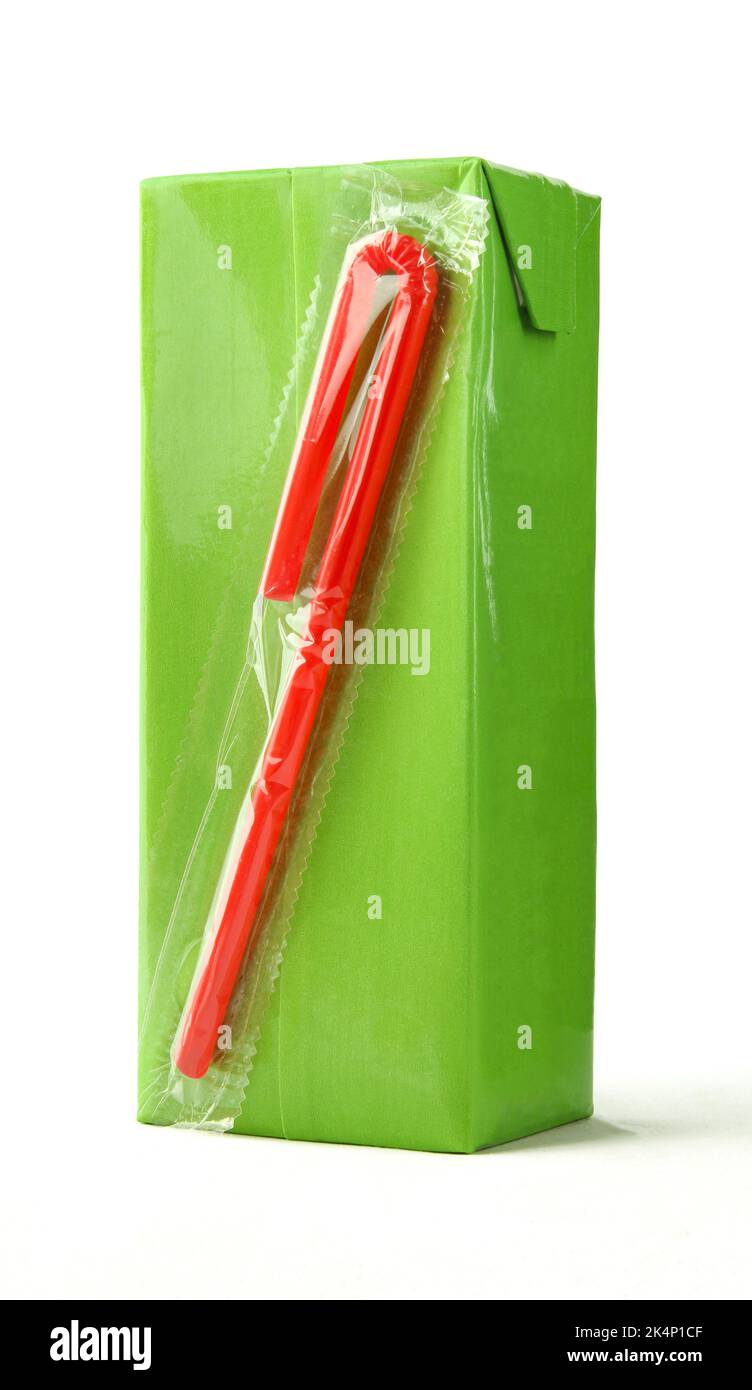 Green carton juice box with red plastic straw attached isolated on ...