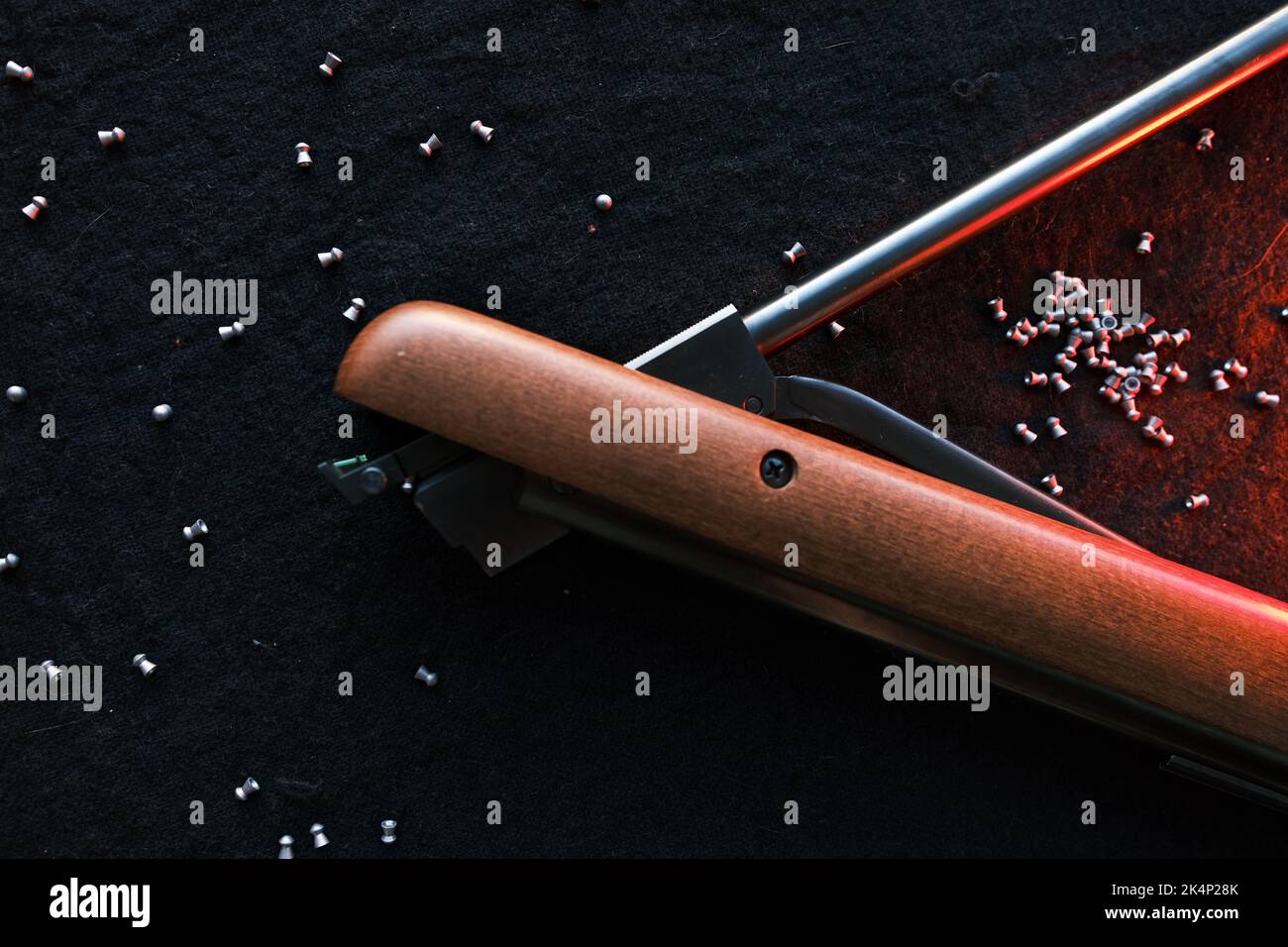 Rifle gun break in two with air pellets for hunting on cloth dark ...