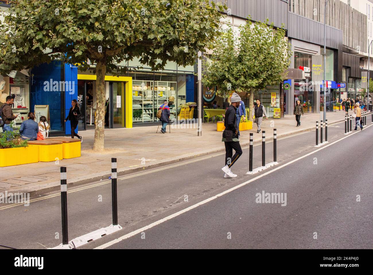 King Street, Hammersmith, London, UK showing bollards operating cycle ...