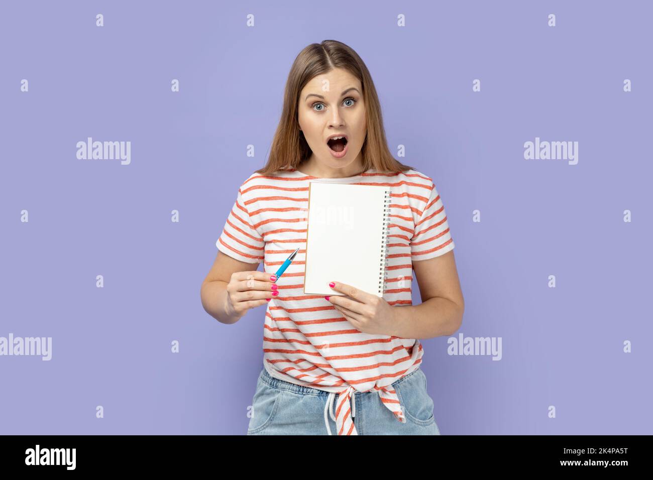 Portrait Of Amazed Surprised Blond Woman Wearing Striped T Shirt