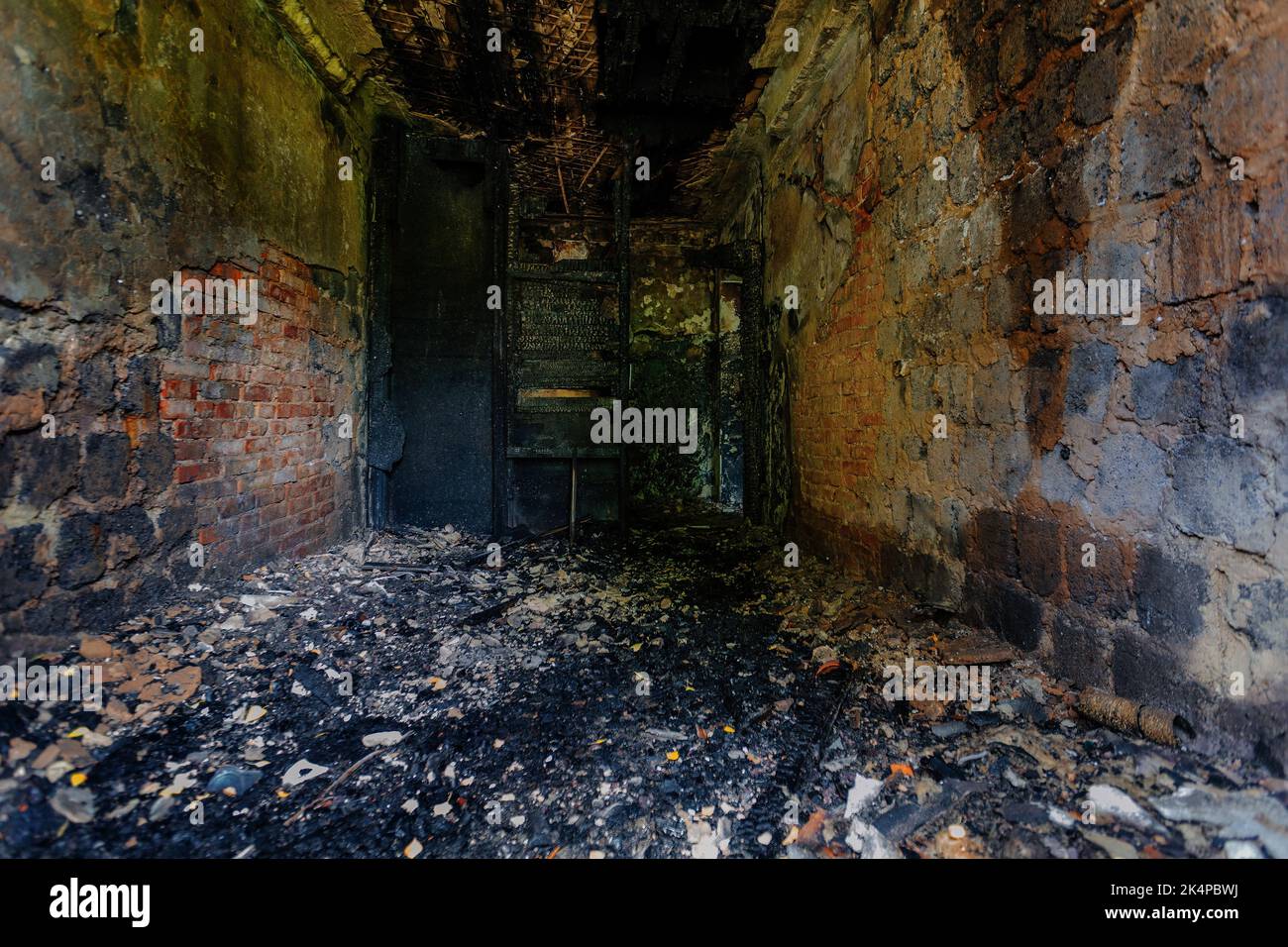 Burnt building interior. Ruined walls in black soot. Consequences of ...