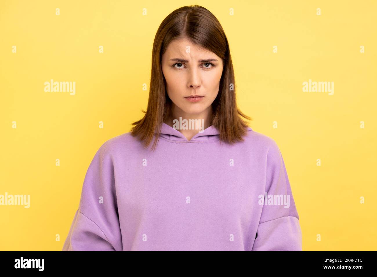 Portrait of disappointed woman being upset of bad news, looking at ...