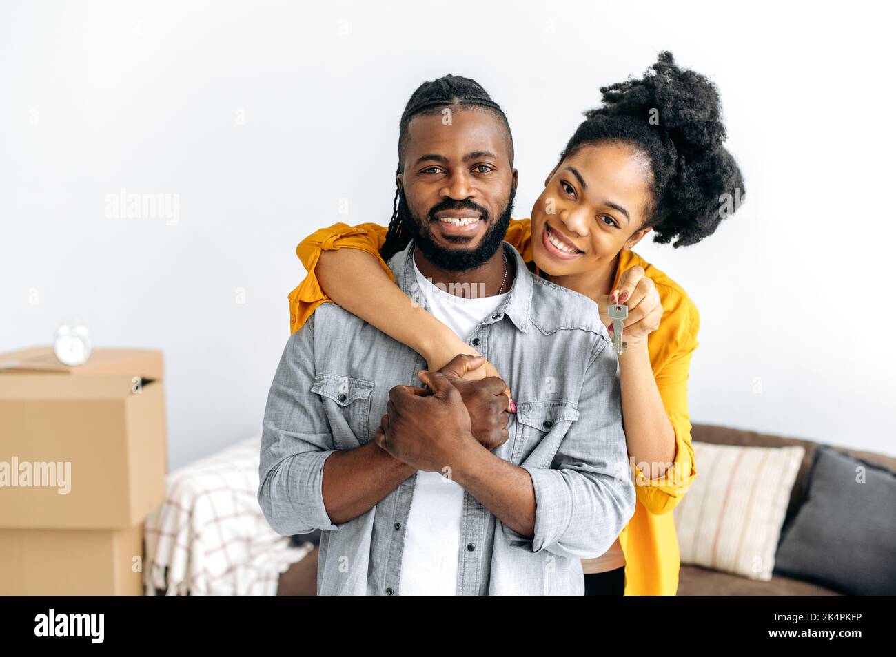 Ownership concept. Happy excited african american family, black couple ...