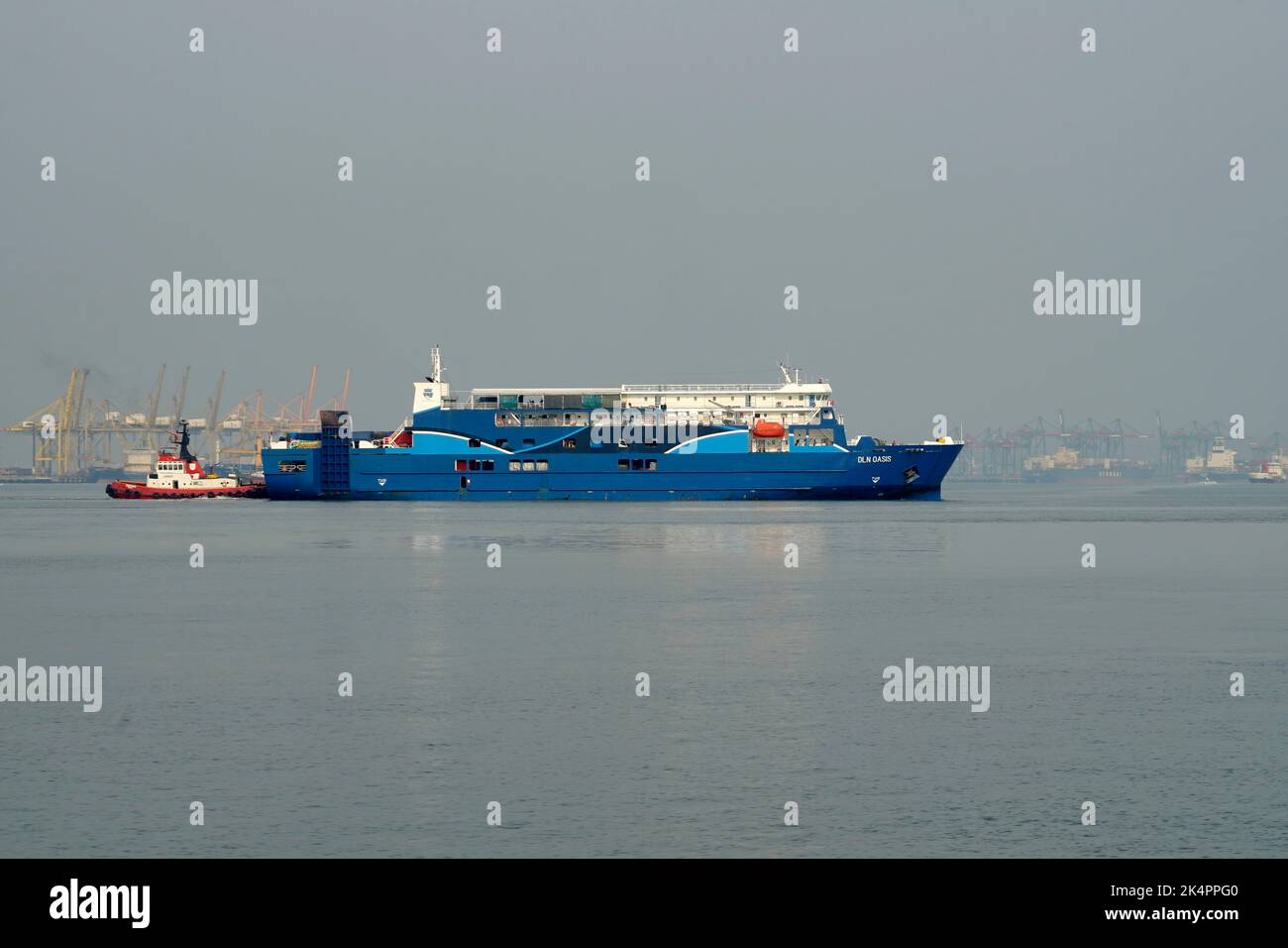Tugboat and transportation ship maneuver in Tanjung Perak port ...
