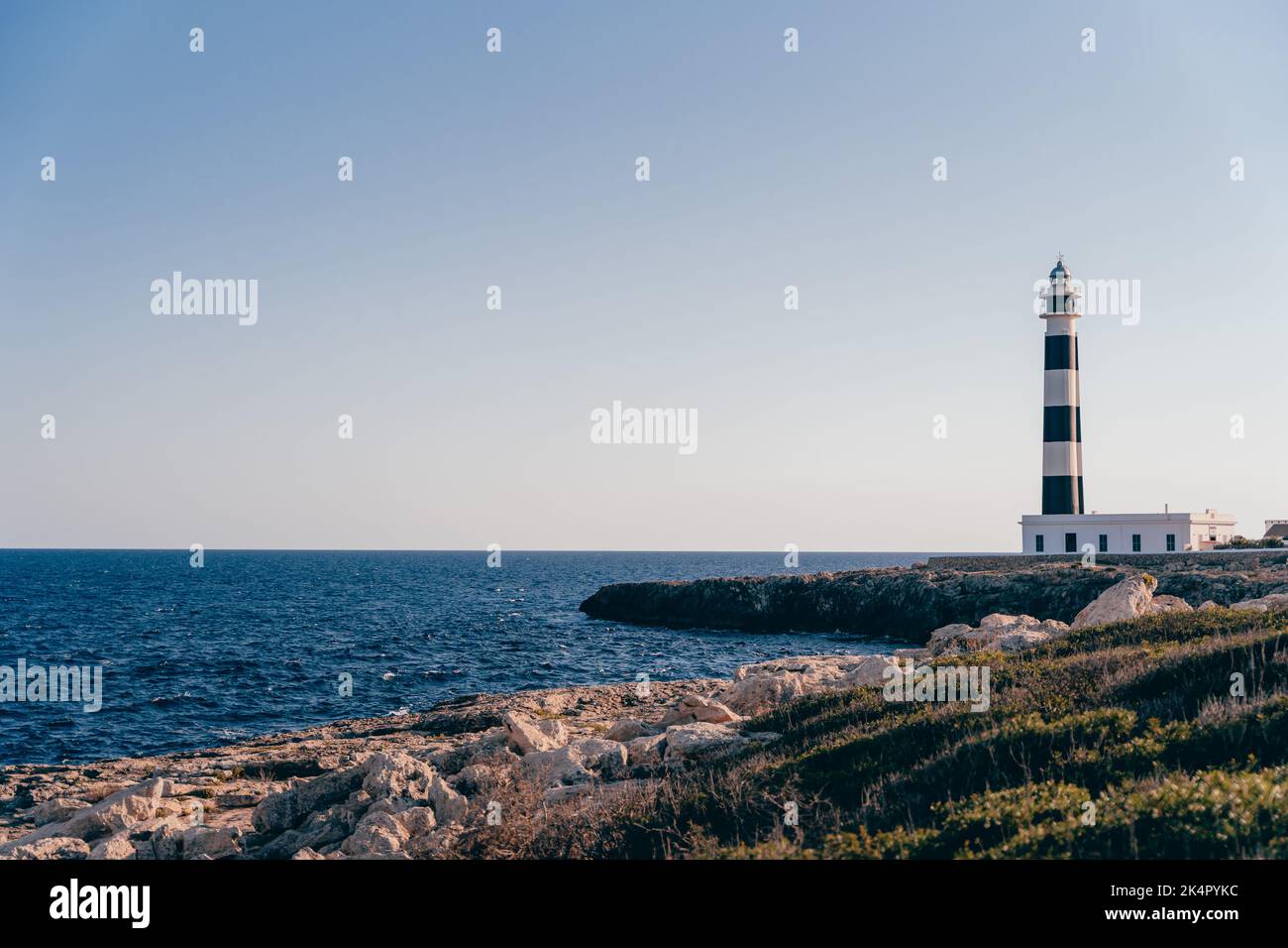 Beautiful blue white lighthouse on the Spanish island of Menorca Stock Photo - Alamy