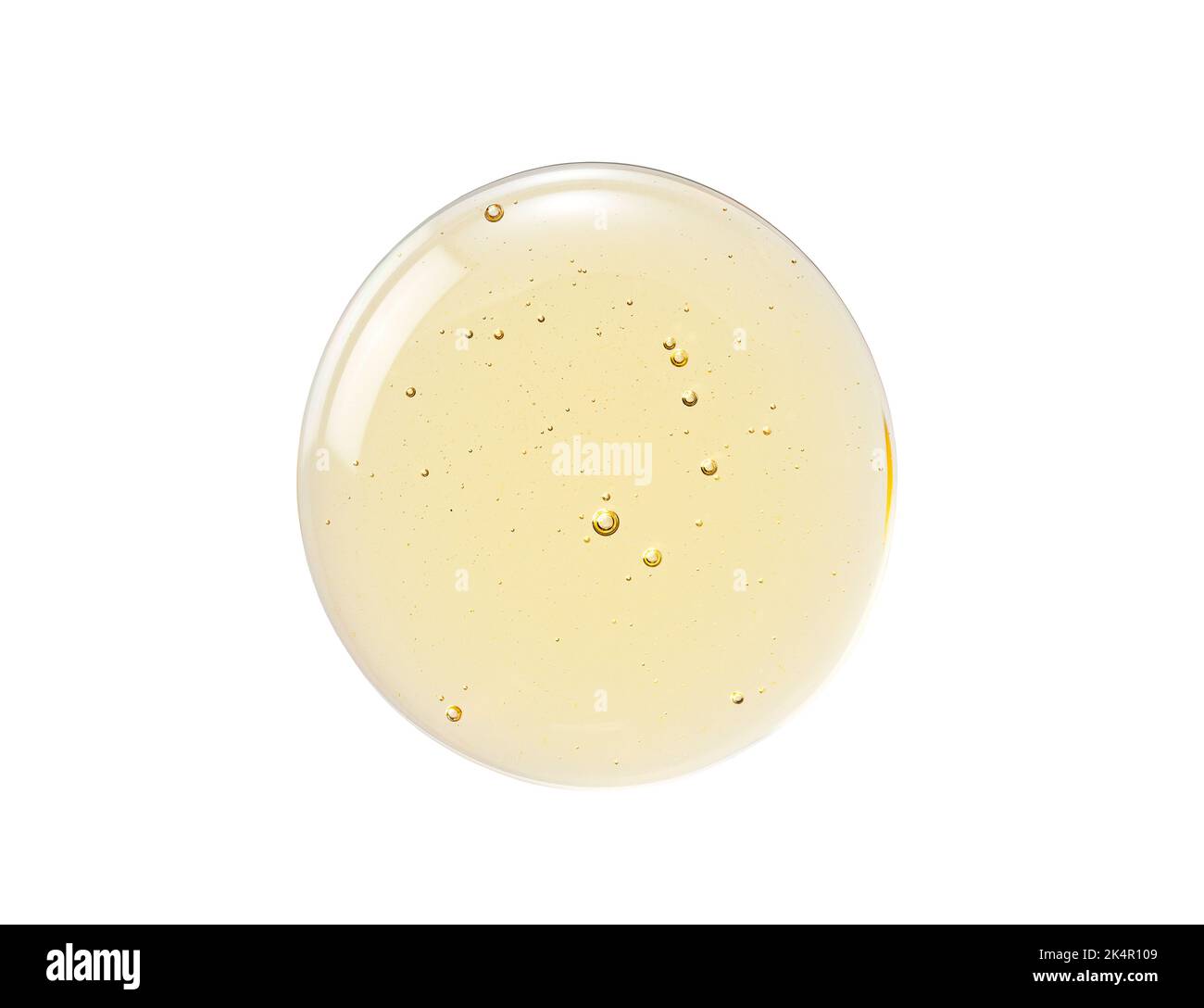 Transparent skin care liquid texture. Yellow serum and bubbles on white ...