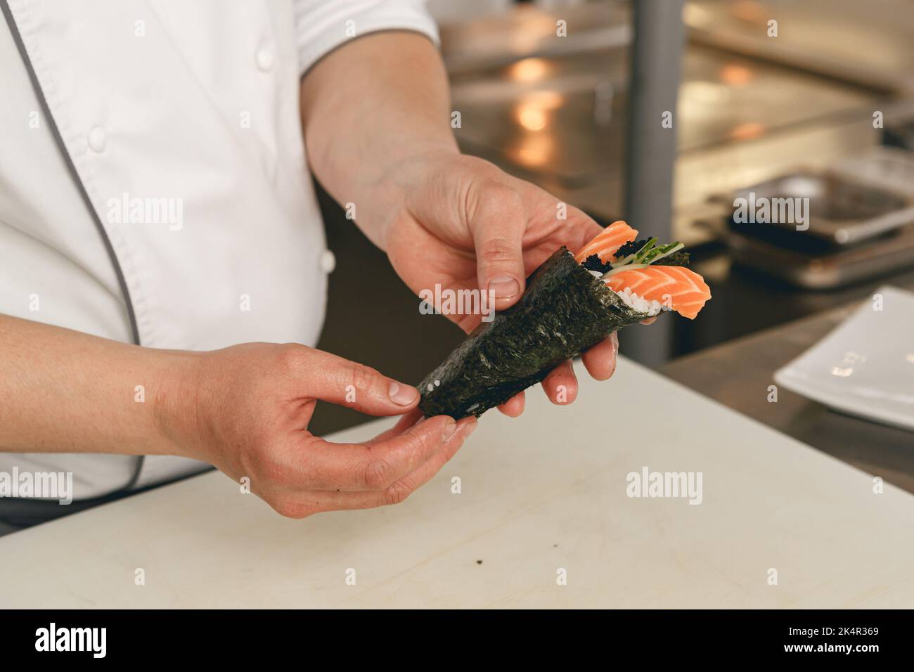 Hands male chef cooking nigiri hi-res stock photography and images - Alamy