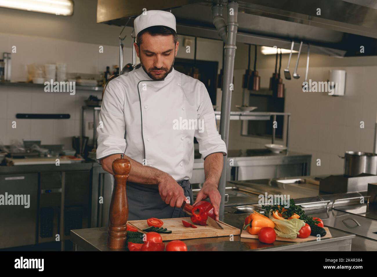 Chef preparing salad in the modern kitchen of restaurant. Tasty and ...