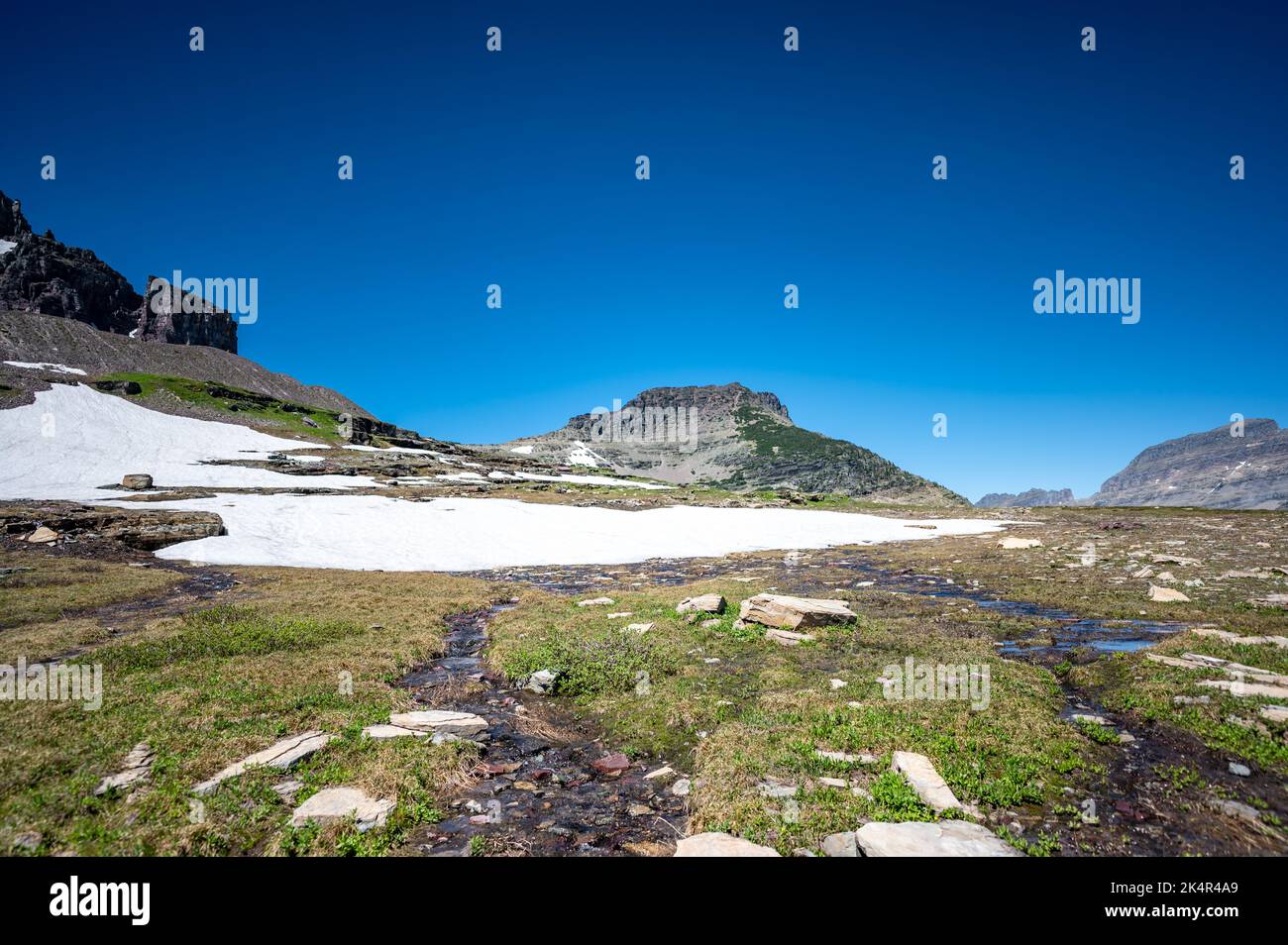 Snow-melt runoff along Logan Pass trail to Hidden Lake at Glacier ...