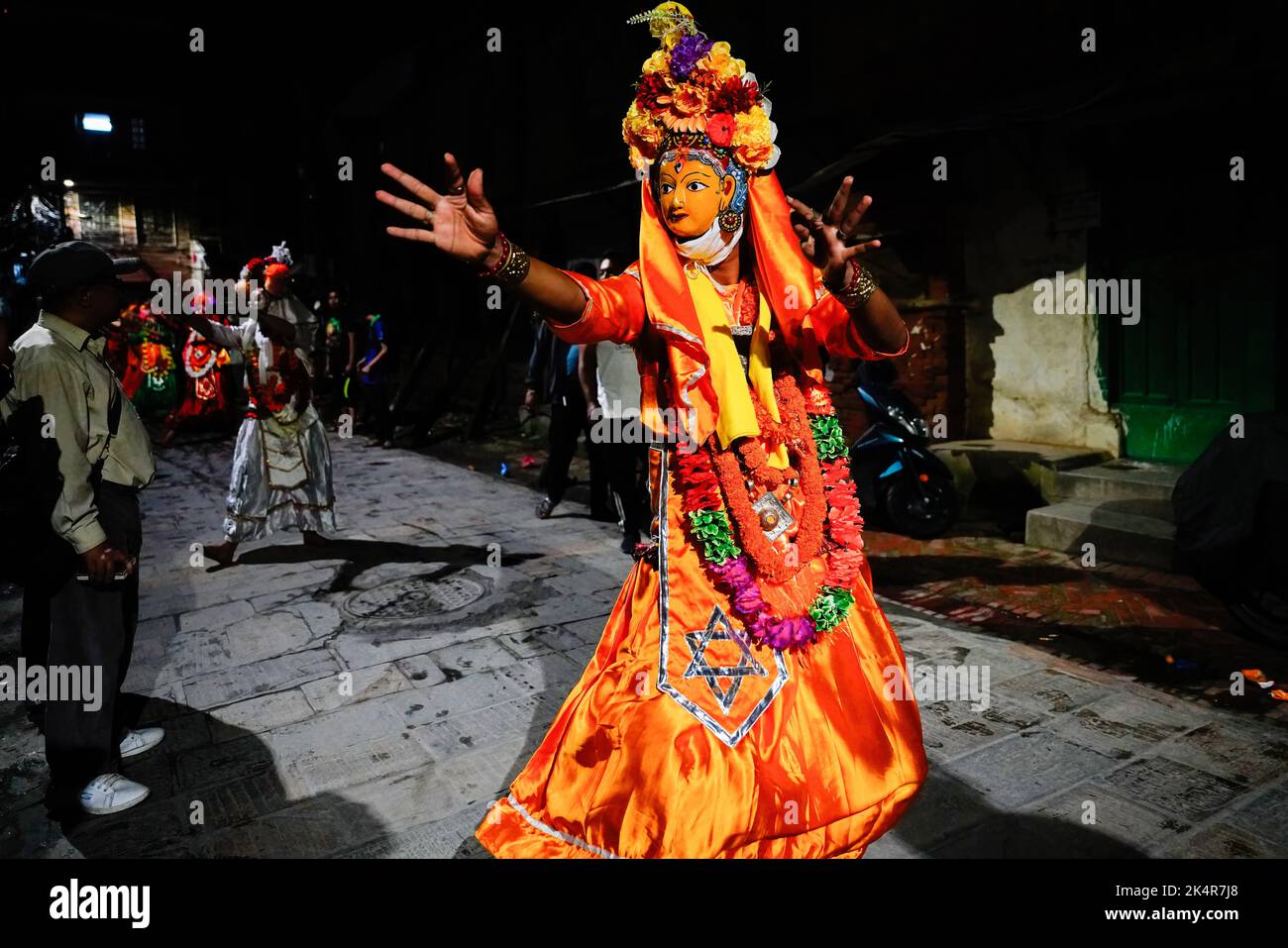 Lalitpur, Nepal. 03rd Oct, 2022. A masked deity performs the ...