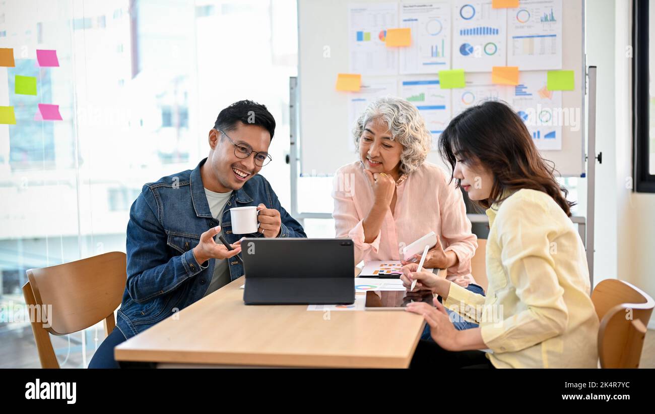 Smart and handsome Asian male marketing manager is explaining and ...