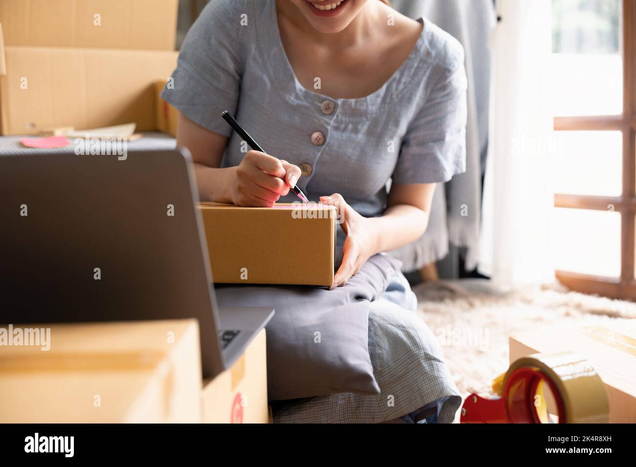 Small businesses SME owners female entrepreneurs writing address on ...