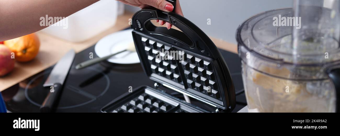Multi cooking open lid hand hi-res stock photography and images - Alamy