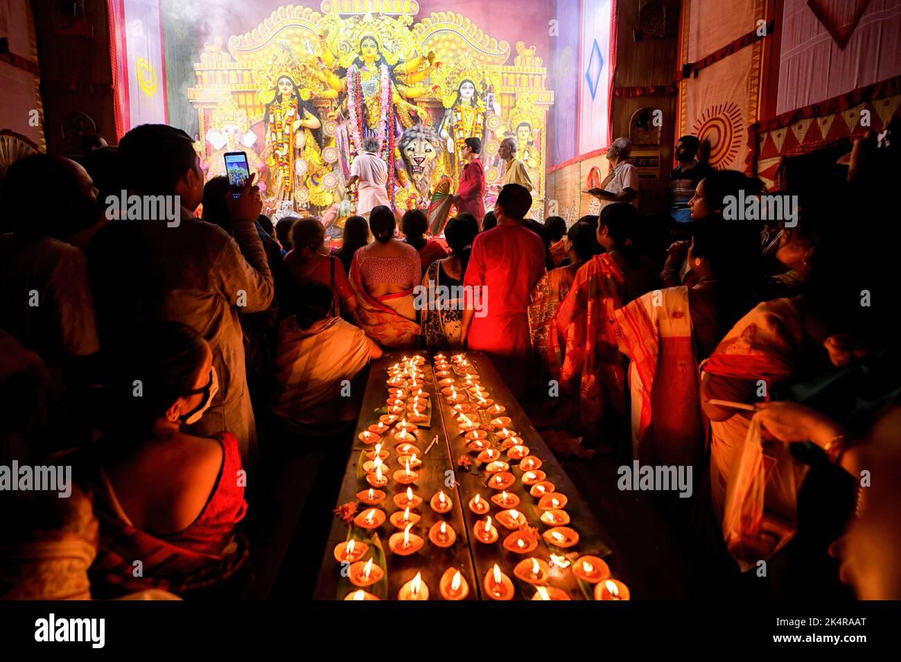 Kolkata, India. 03rd Oct, 2022. Hindu devotees light Diyas (clay lamps ...