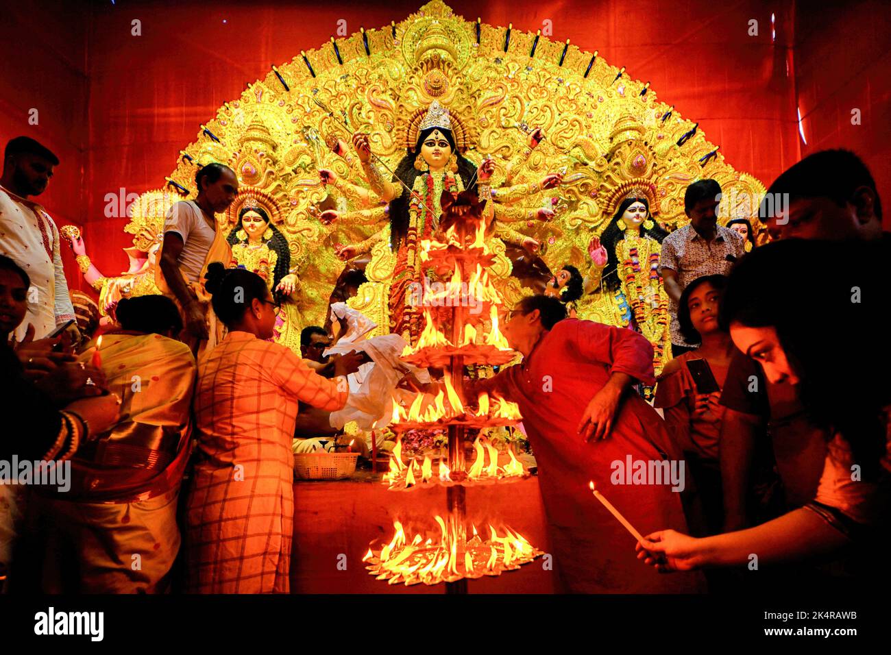 Kolkata, India. 03rd Oct, 2022. Hindu devotees light Diyas (Soil made ...