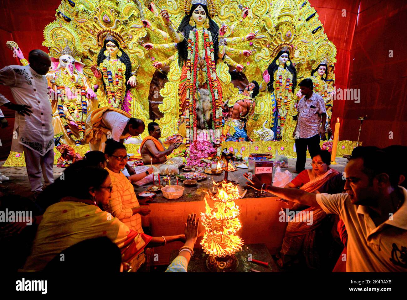 Kolkata, India. 03rd Oct, 2022. Hindu devotees light Diyas (Soil made ...