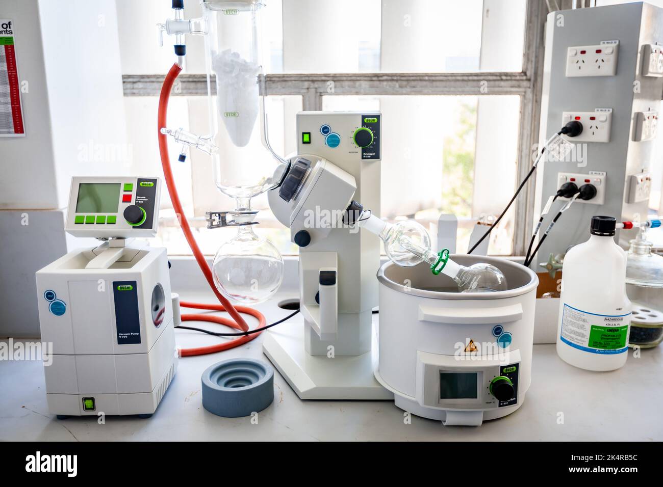 Window-lit laboratory bench featuring an evaporator and other chemistry ...